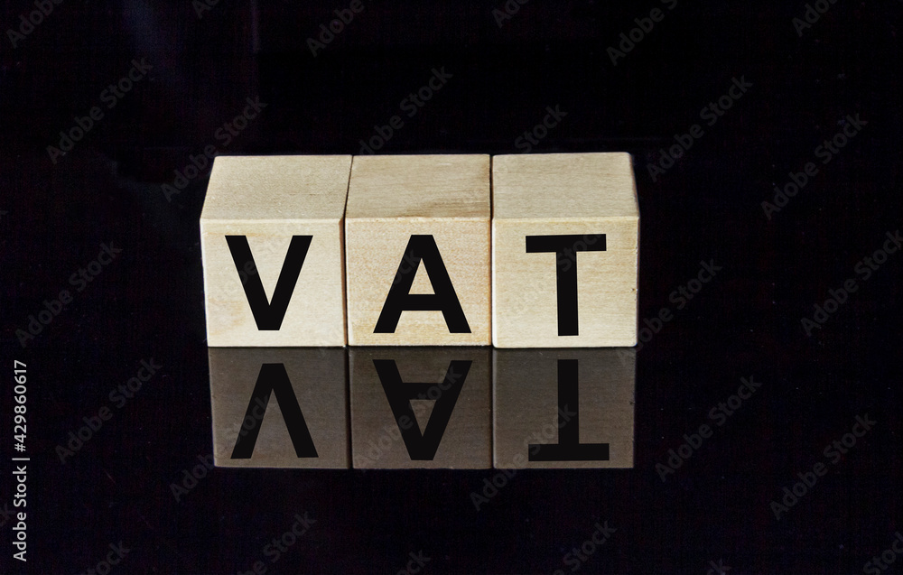 VAT, value added tax concept by wooden block cube with alphabet ...