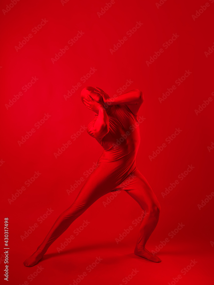 crazy red man on a red background. figure in a leotard covering the ...
