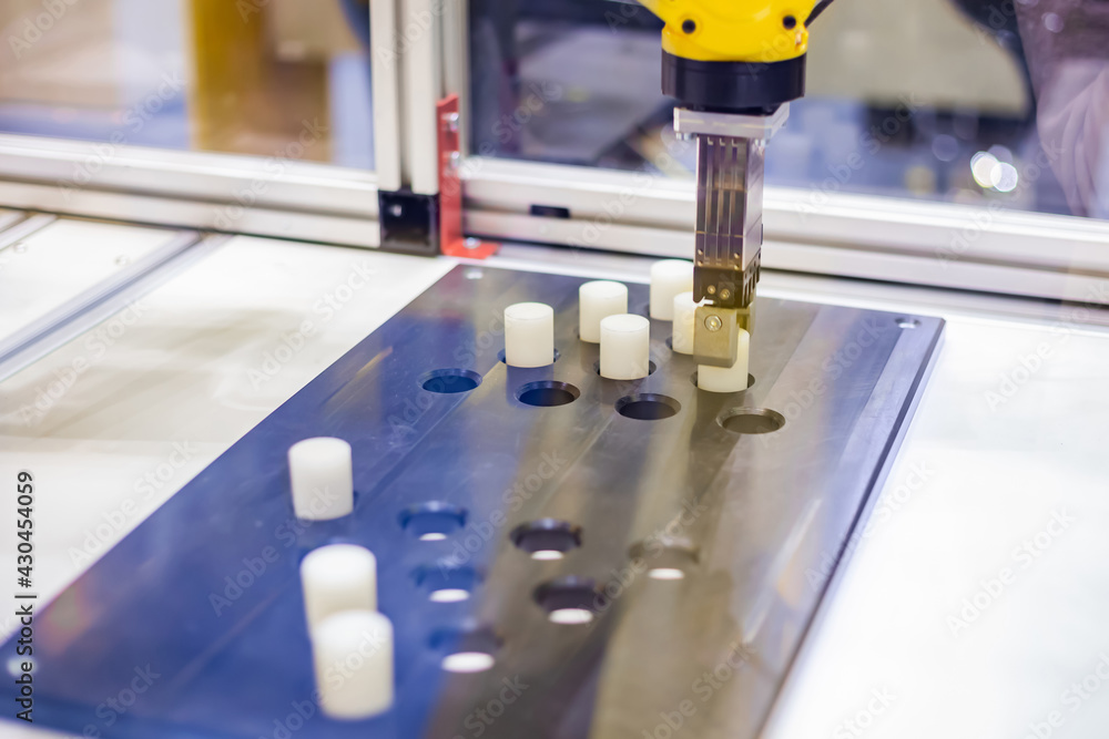 Pick and place robotic clamp arm manipulator moves and lifts objects at ...