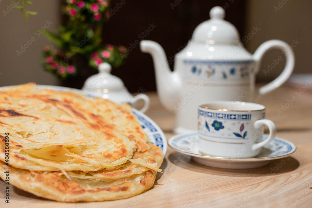 paratha with chai tea set Indian and Pakistani food Stock Photo | Adobe ...