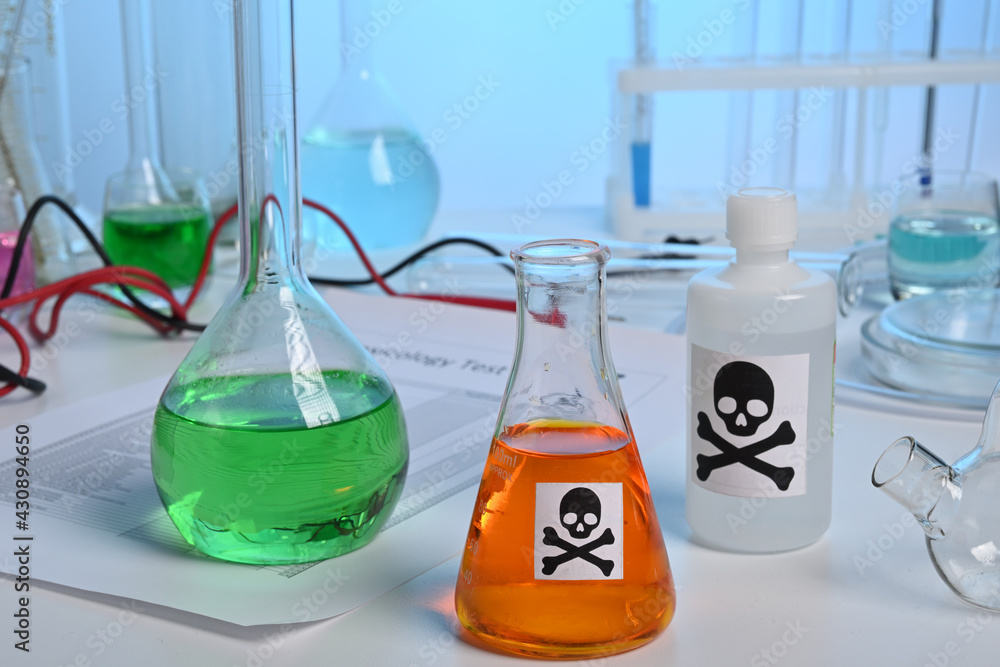 Fotografie Toxic lab production of orange poison juice liquid ...