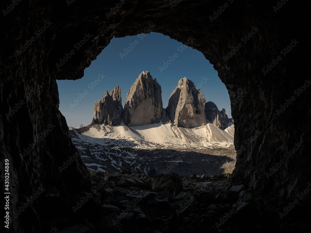 Cave window view of Tre Cime di Lavaredo alpine mountain panorama in ...