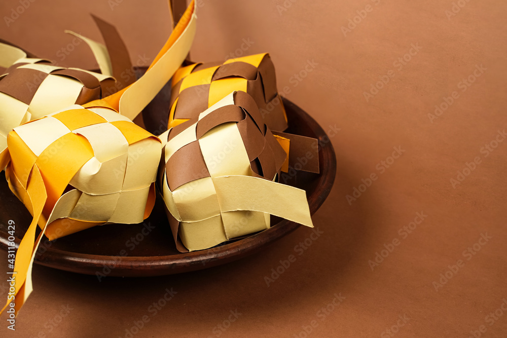 Replica of steamed diamond shaped rice made of colored cardboard ...