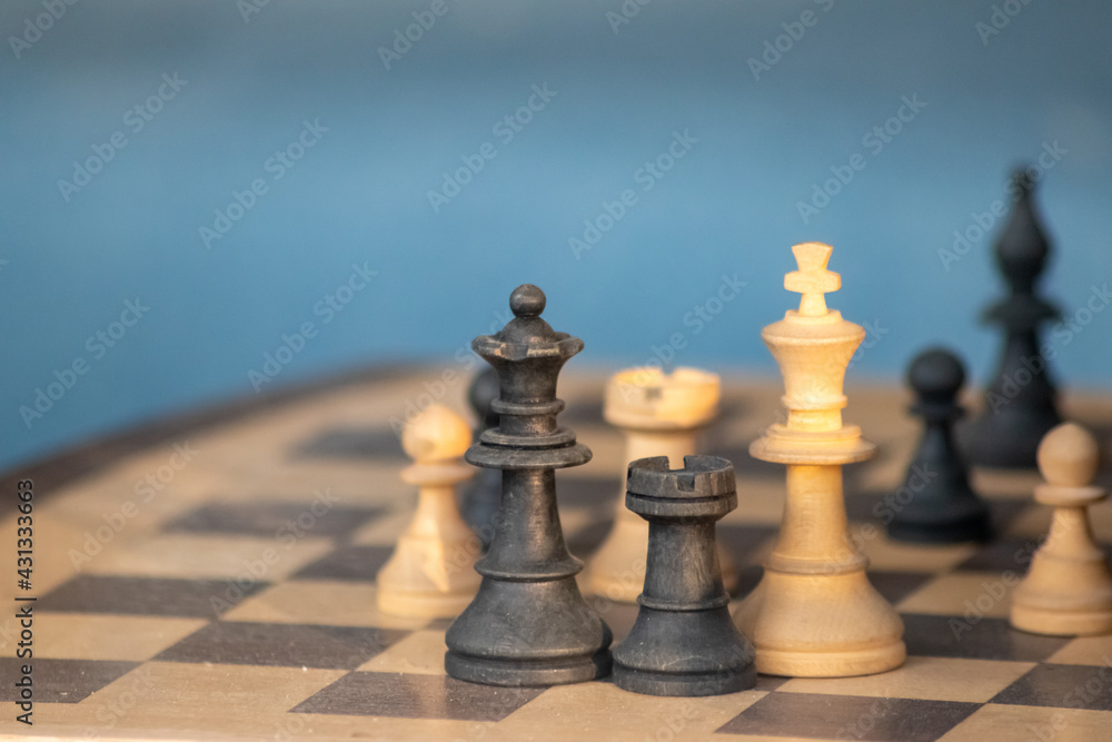 Wooden chess figures on antique chess table show the competitive chess ...