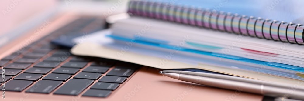 Pen and documents are on the keyboard Stock Photo | Adobe Stock