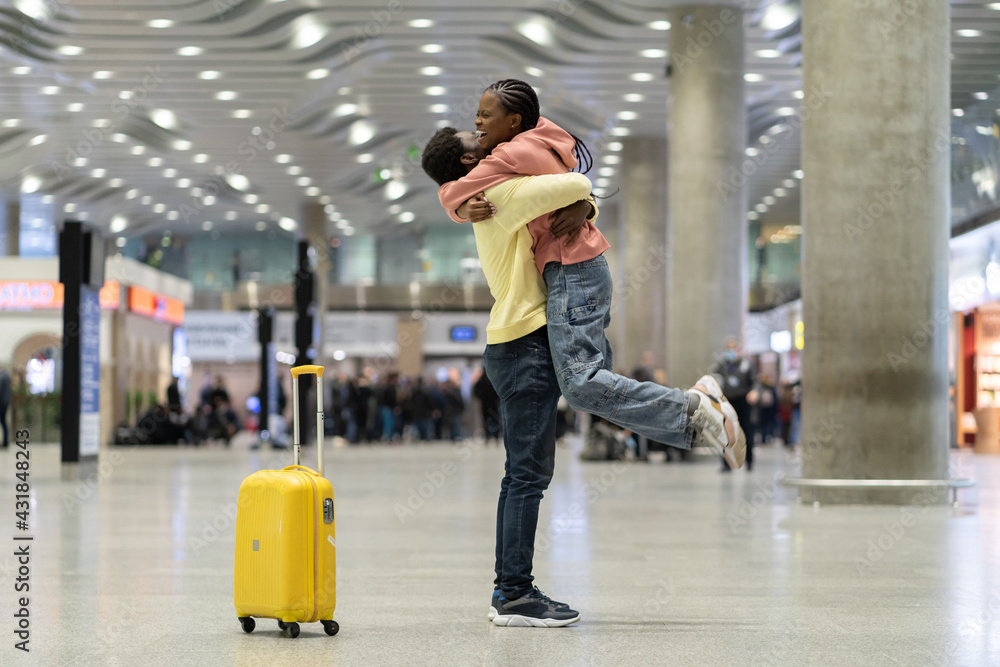 Happy meeting of loving couple after long time. African man and woman ...