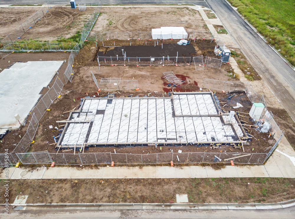 Aerial view of a house in the early stages of construction, preparation ...