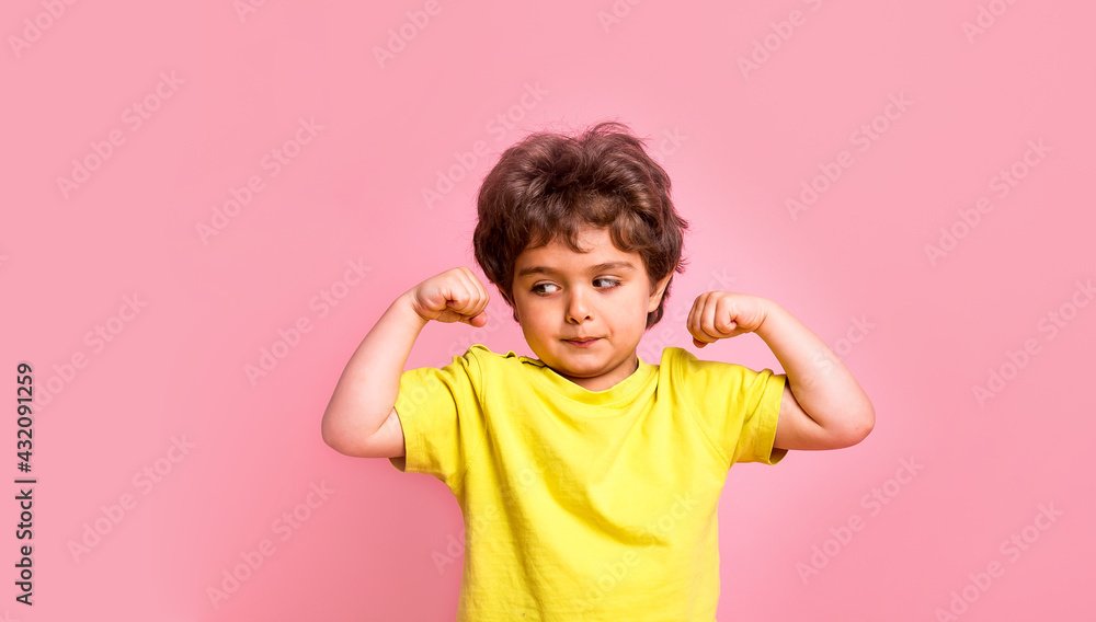 Stock-Foto „Funny strong child showing his muscles. Little kid boy ...