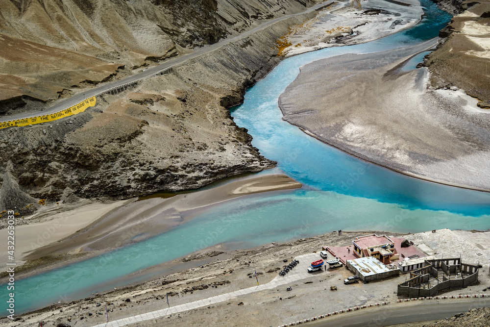 Aerial view of a river meeting another river with different color at a ...