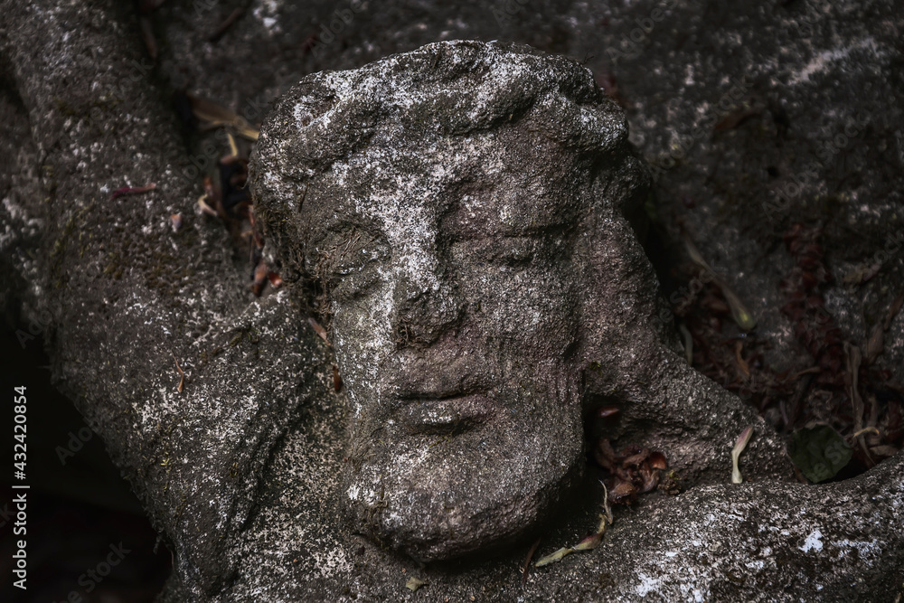 Ancient partially destroyed stone sculpture of Jesus Christ crucified ...