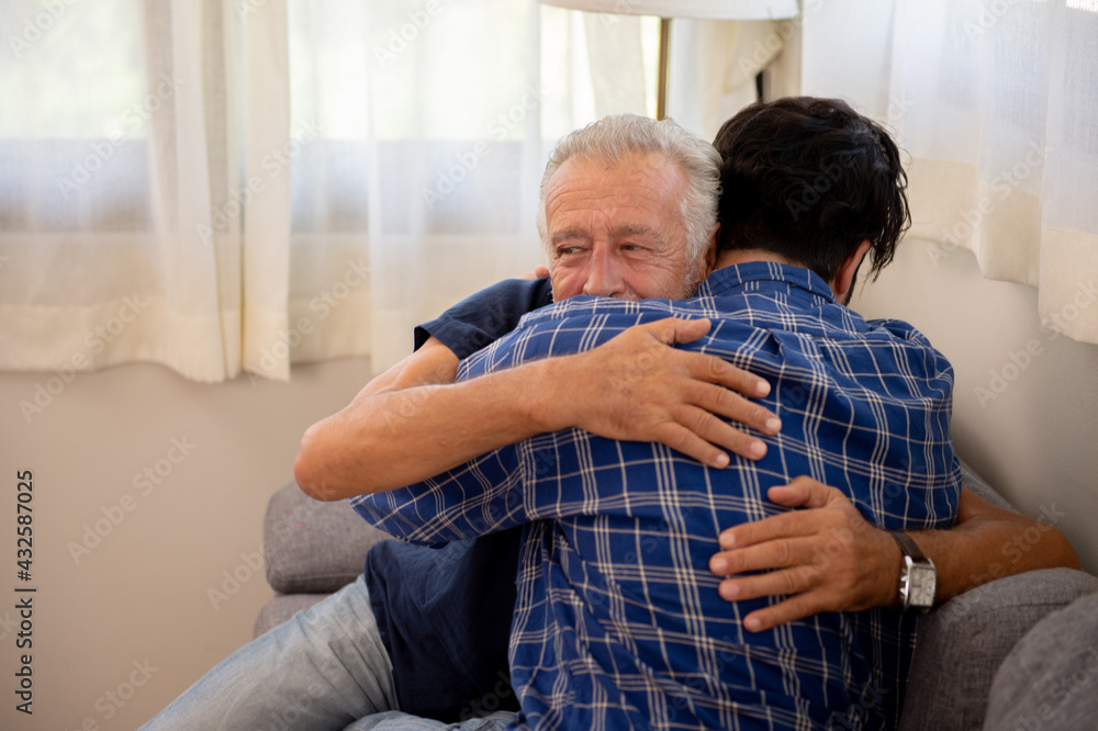Caucasian senior father comforting and hugging depressed adult son in ...