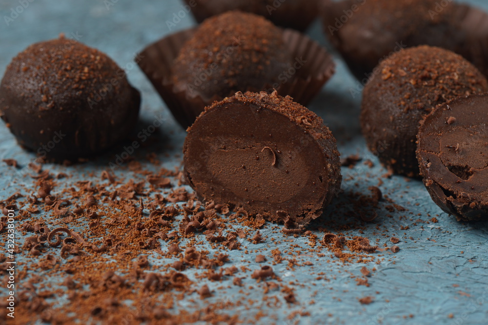 Chocolate petit fours on a table. Chocolate petit four sweets with ...