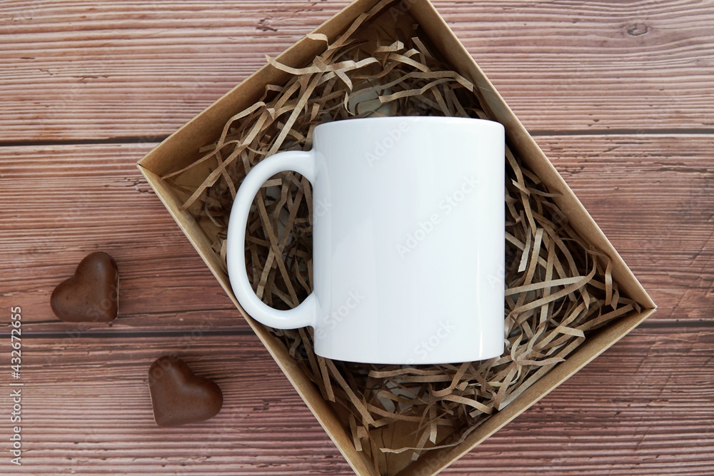 White plain coffee mug mockup in gift box, rustic dark wood background ...