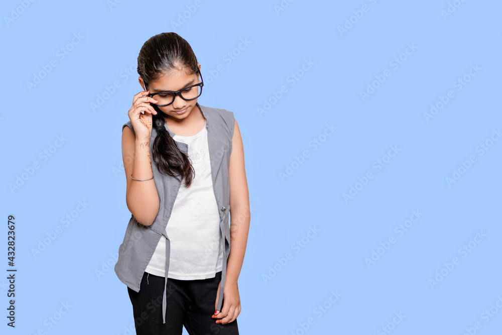 Cute indian little girl wearing spectacles Stock Photo | Adobe Stock