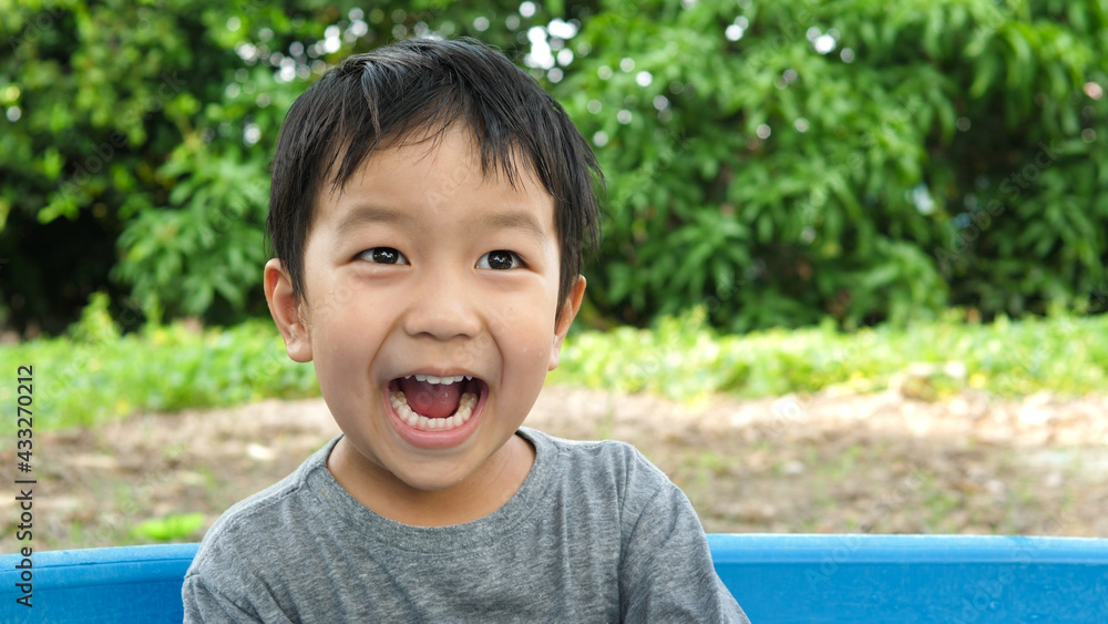Asian cute child boy laughing with mouth open wide, whitening teeth ...