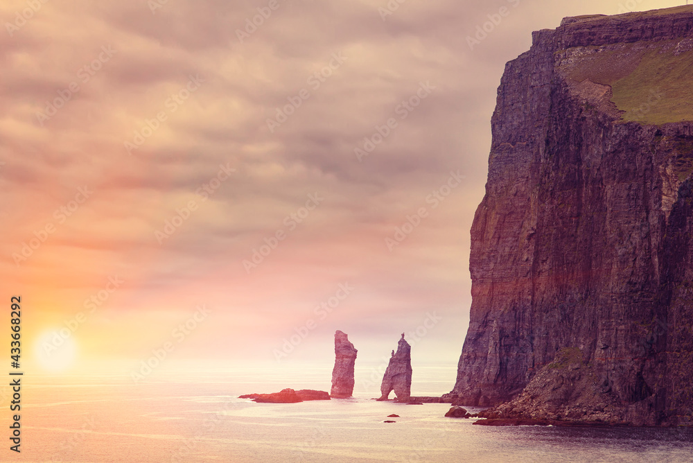 Two famous sea stacks Risin og Kellingin (the Giant and his Wife) in ...