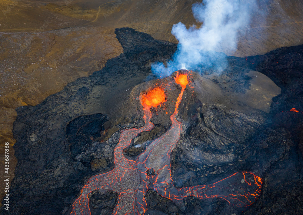 Photo Stock From above magma sparks out of the volcano hole and run ...