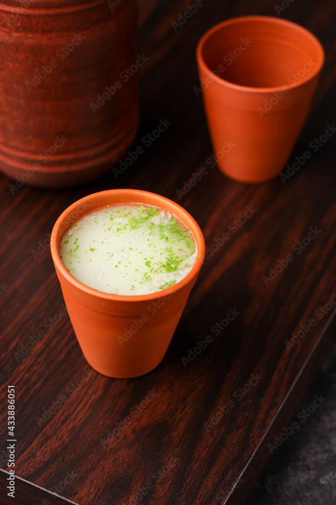 Spiced buttermilk in clay pot , chaas , chaach , moru , sambharam ...