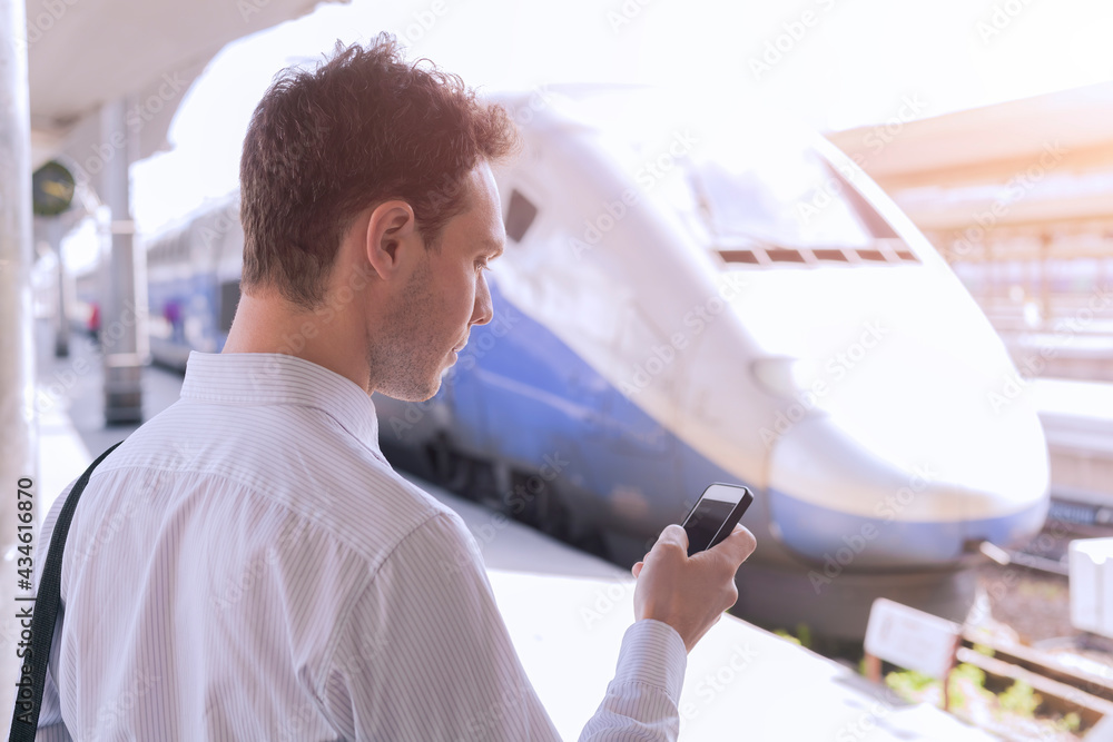 Person using app on smartphone during business travel with train in ...