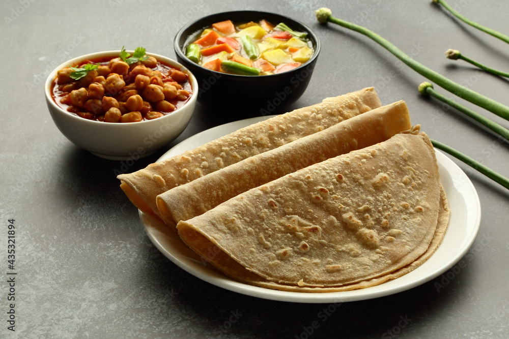 Homemade delicious whole wheat chapati served with chickpeas ,masala ...
