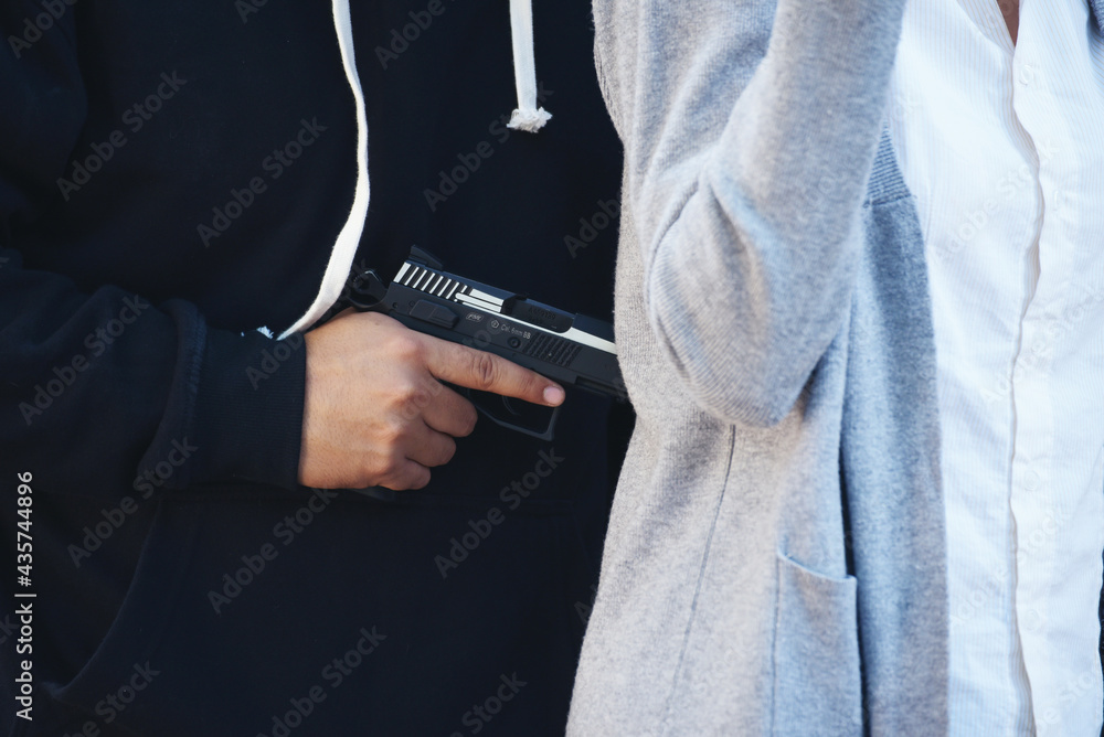 Thief armed man rob woman by gun on street so scared shocked face ...