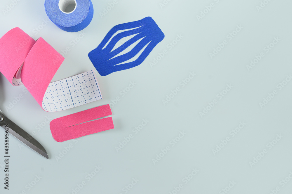 Kinesiology tape in differnt shape for application on blue. Kinesiology ...