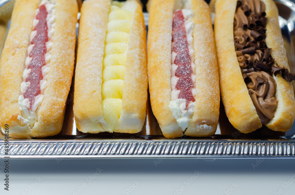 Mixed finger donuts filling chocolate, custard, jam and whipped cream ...