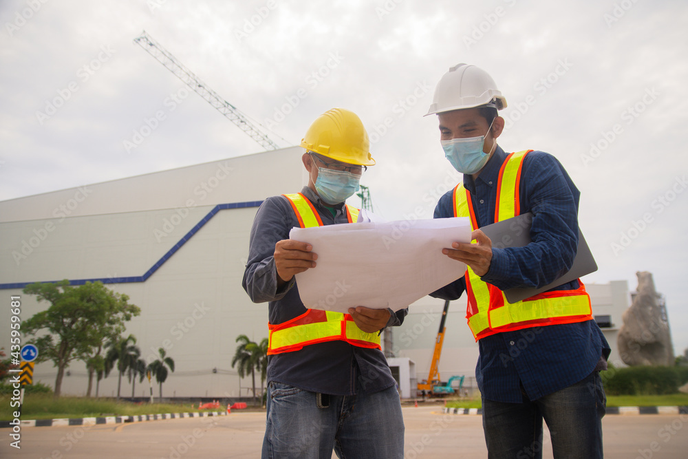two engineer teamwork working blueprint on site construction,Engineer ...