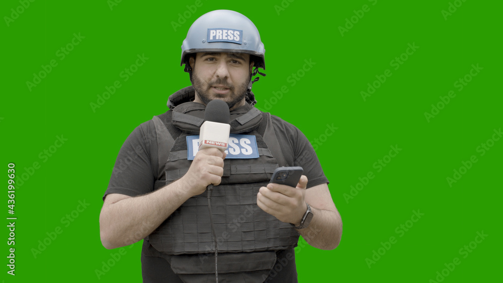 GREEN SCREEN CHROMA KEY War journalist wearing protective helmet and ...