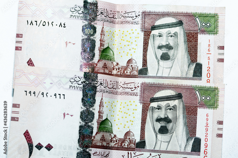 Stack of Saudi Arabia 100 riyals banknote, the obverse of Saudi kingdom ...