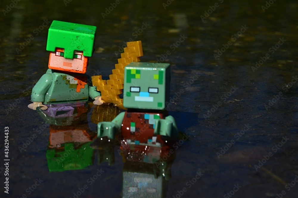 Fotografie Minecraft LEGO figure of Alex with golden sword and tortoise ...