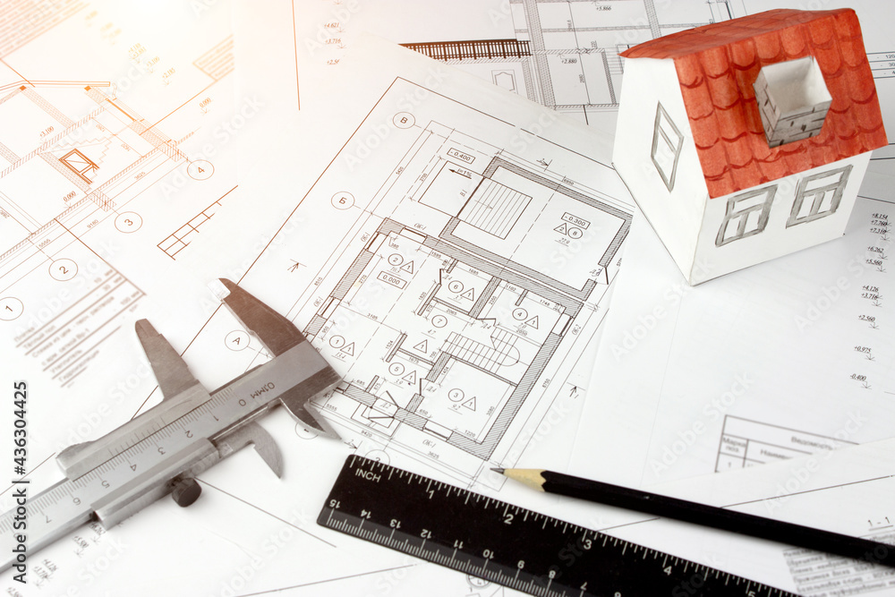 Paper architectural drawings and blueprint, interior design plans and ...