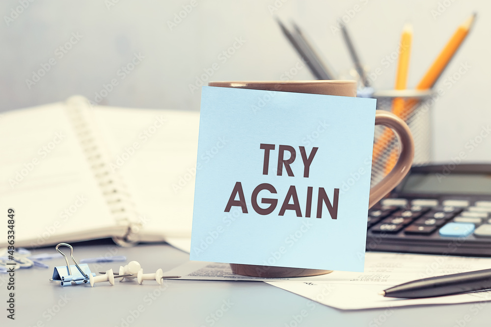 Try Again - concept of text on sticky note. Work and study concept ...