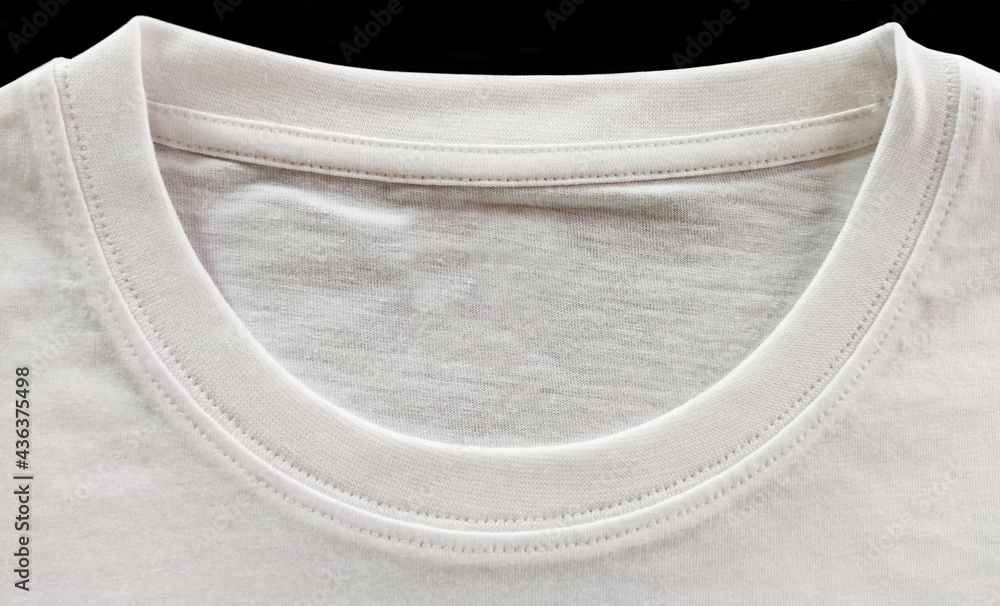 A closer look at the round-neck T-shirt. Front and back neck drop for a ...
