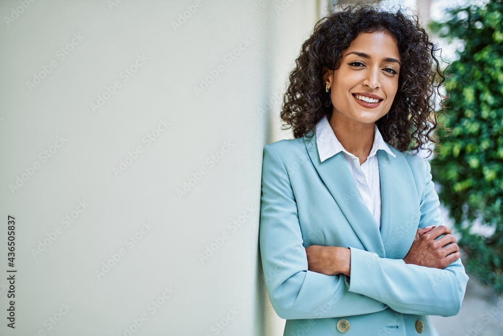Young hispanic business woman wearing professional look smiling ...