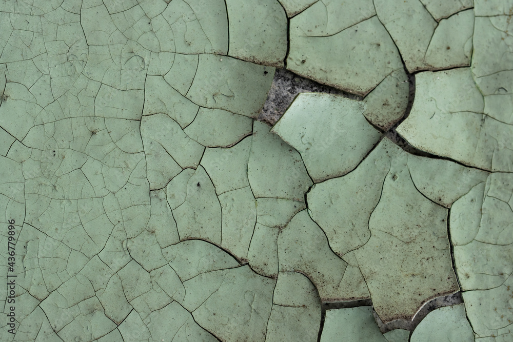 Green peeling paint on the wall. Old concrete wall with cracked flaking ...