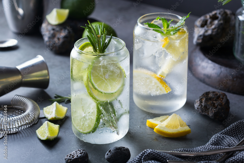 Hard seltzer cocktails with lime and lemon and bartenders accessories ...