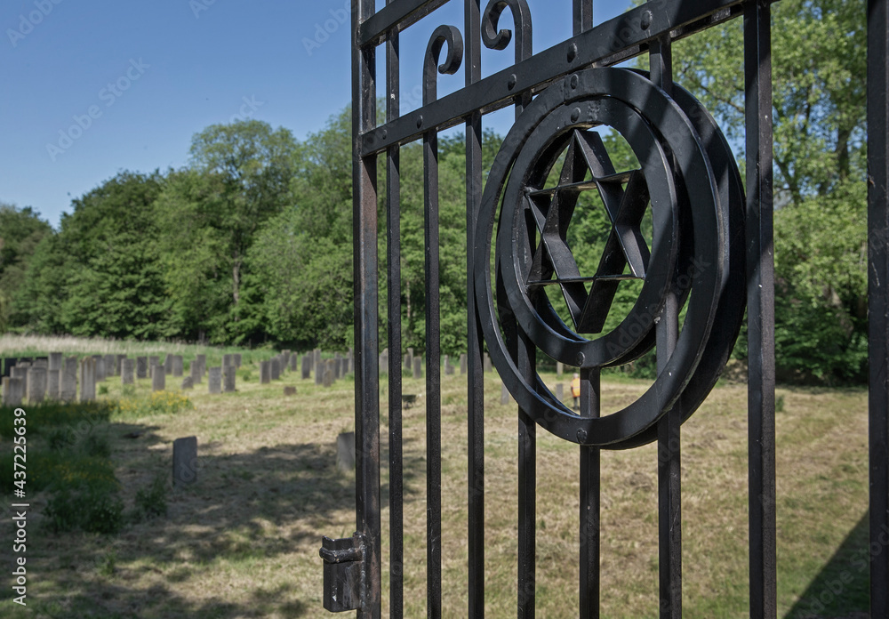 Gate at Abandoned Jewish cemetry with old gravestones. Thombstones ...