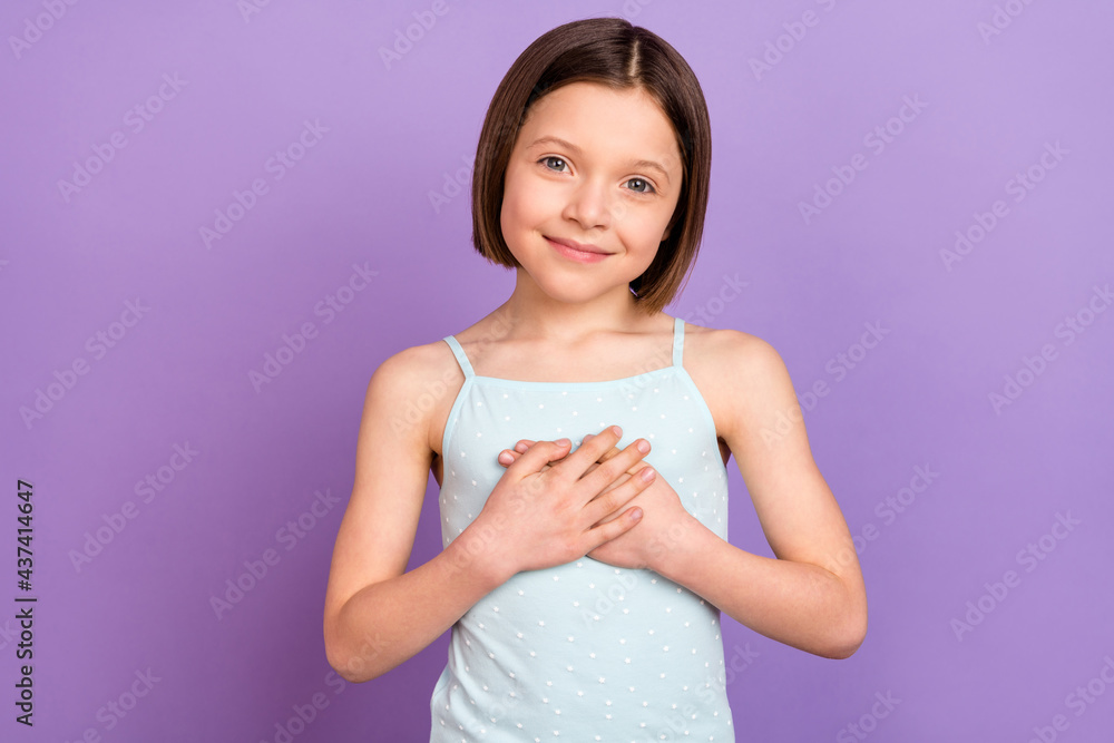 Photo of positive happy young little girl hold hands heart pledge ...