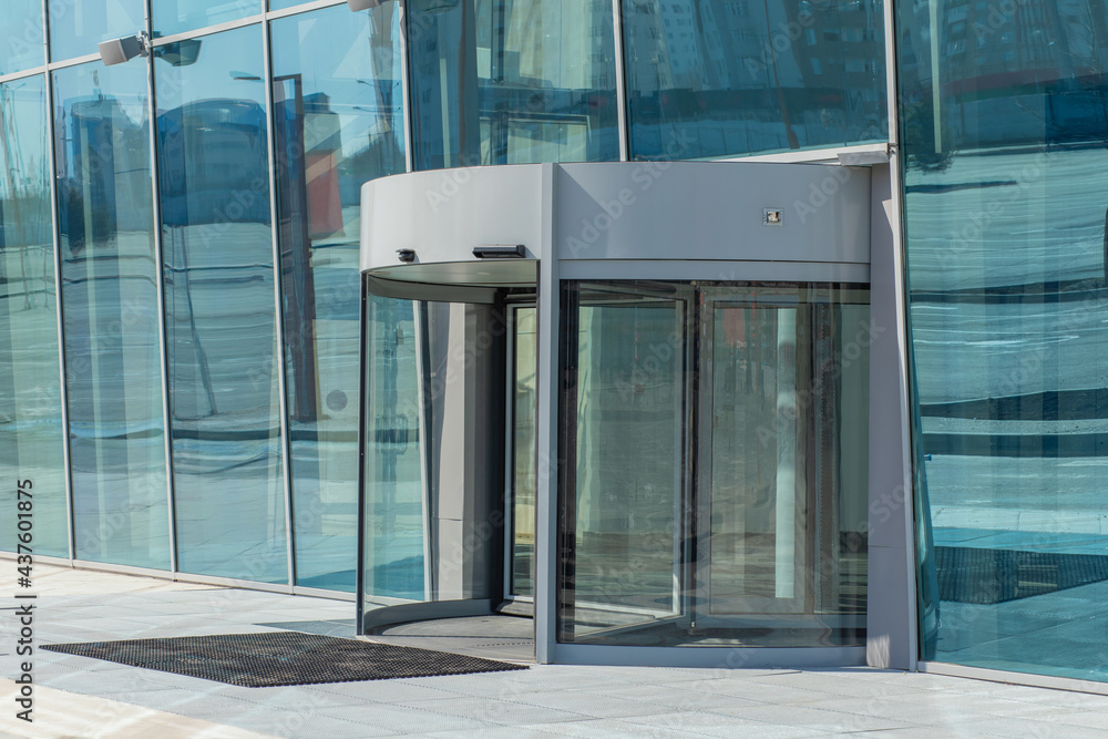 Foto de Stock Revolving carousel rotary doors at entrance to building ...