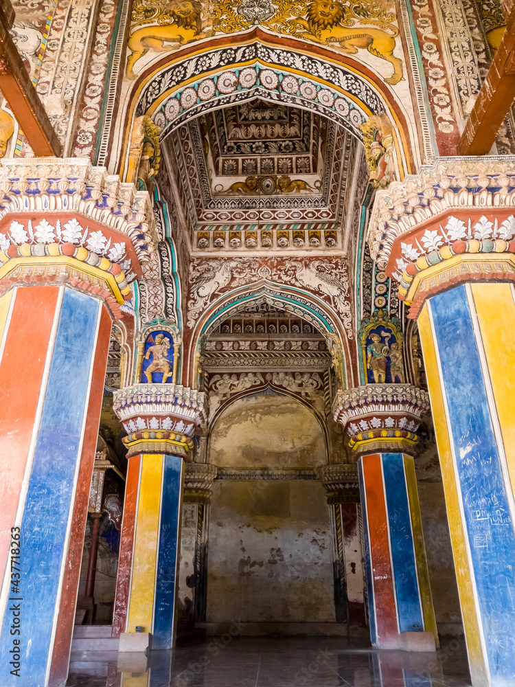 The high arches and colorfully painted walls in a hallway at the ...