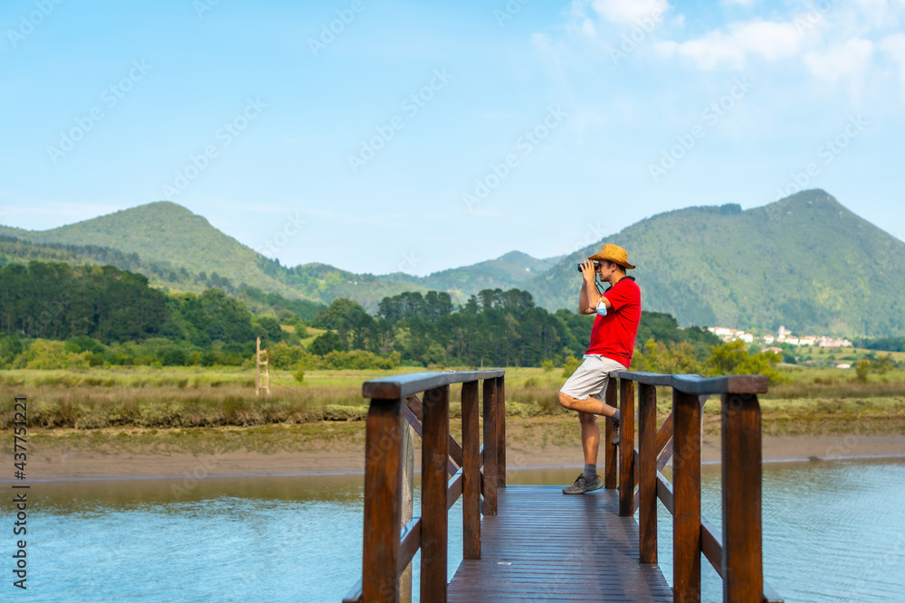 Watching birds with spyglasses from the wooden piers of the Urdaibai ...