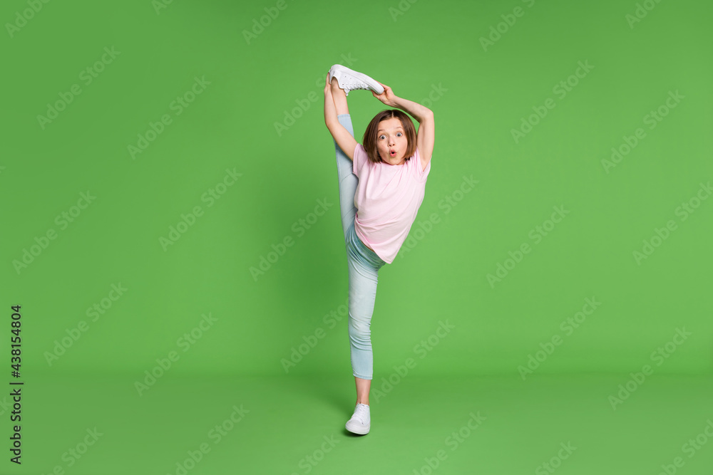 Full size photo of young little girl hold leg stretch split gym ...