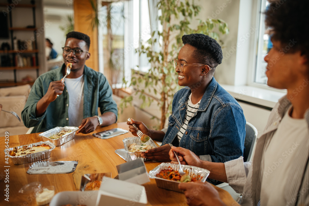 Delicious lunch break with friends at home Stock Photo | Adobe Stock