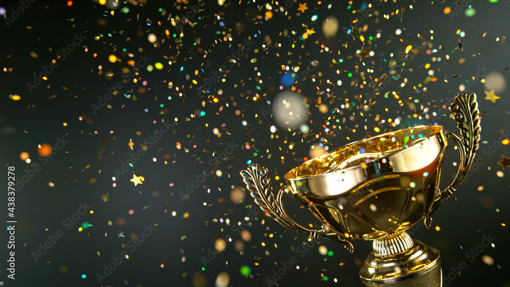 Champion golden trophy isolated on black background. Concept of success ...