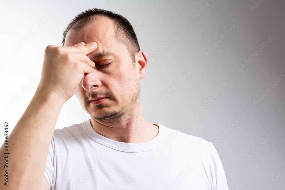 Horizontal photo of Caucasian man pictured isolated on gray background ...
