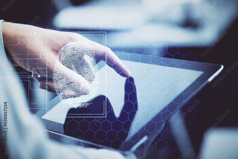 Double exposure of man's hands holding and using a digital device and ...