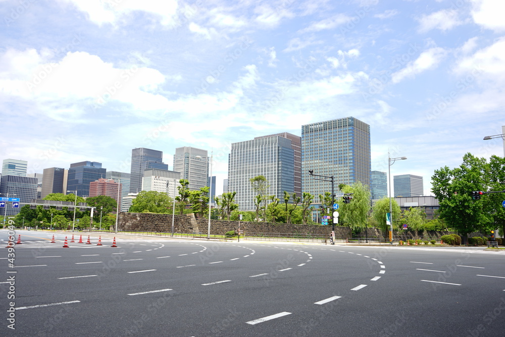 Iwaidabashi bridge intersection. Urban road lined with office and ...