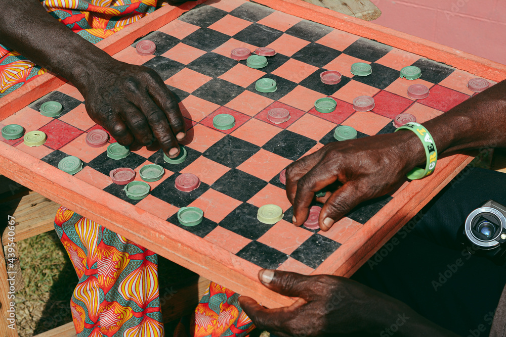 Men playing Draft board game Stock Photo | Adobe Stock