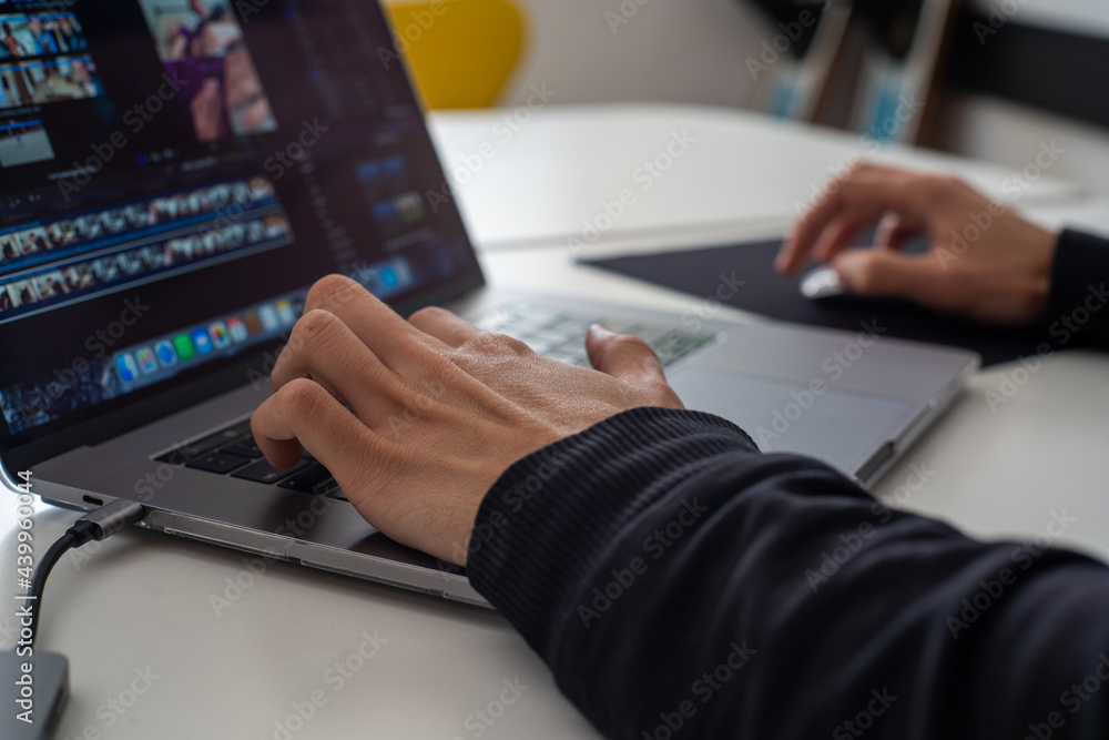 Person editing videos and photos on his laptop in his house Stock Photo ...